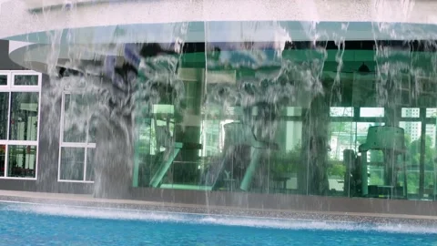 Gym room with waterfall at outside | Stock Video | Pond5