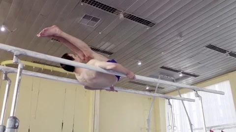 Gymnast acrobatic exercises parallel bar... | Stock Video | Pond5