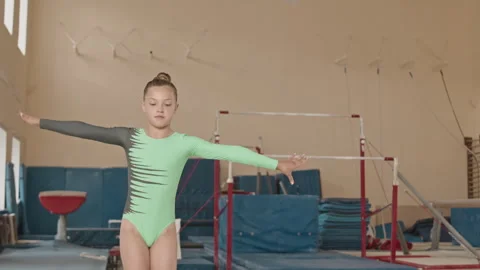 Gymnast Girl Doing Split Jump in Studio | Stock Video | Pond5