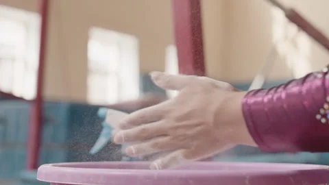 Gymnast Rubbing Chalk Powder on Hands be... | Stock Video | Pond5