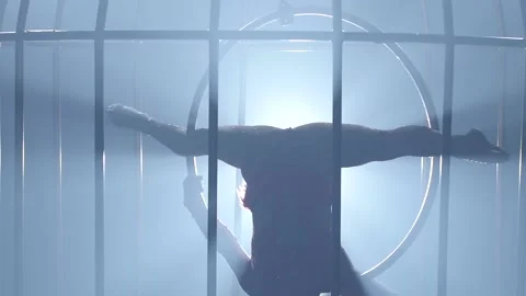 Gymnast spinning on the air hoop on a sm... | Stock Video | Pond5