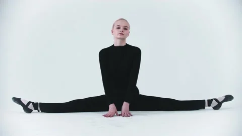 Gymnastics - young woman sitting in a sp... | Stock Video | Pond5
