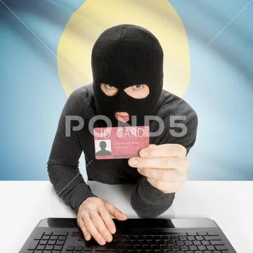 Hacker with flag on background holding ID card in hand - Palau Hacker ...