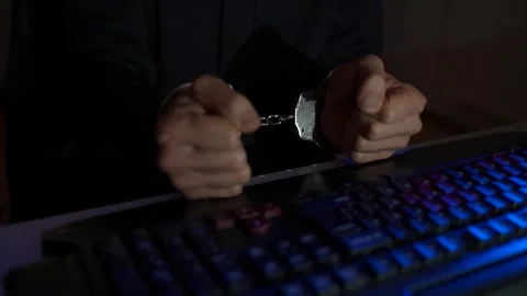 Hacker trying to unclog handcuffs. Polic... | Stock Video | Pond5