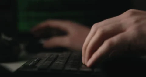 Hacker is typing keys on a keyboard in h... | Stock Video | Pond5