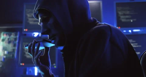 A hacker wearing a mask to cover his fac... | Stock Video | Pond5