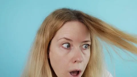 Hair loss, woman horrified by how her ha... | Stock Video | Pond5