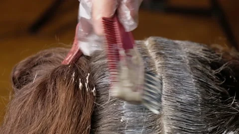 hair root coloring, master dyes hair | Stock Video | Pond5
