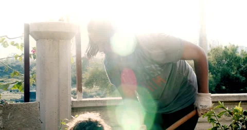 Half-breed woman doing work with pickaxe... | Stock Video | Pond5