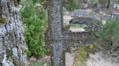 The half cross tombstone inside the ceme... | Stock Video | Pond5