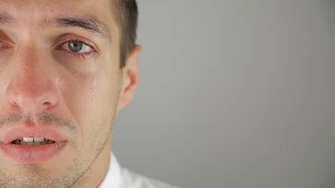Half face portrait of sad man crying wit... | Stock Video | Pond5