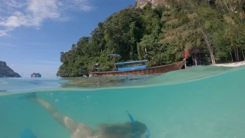 Half in half out of water shot of female... | Stock Video | Pond5
