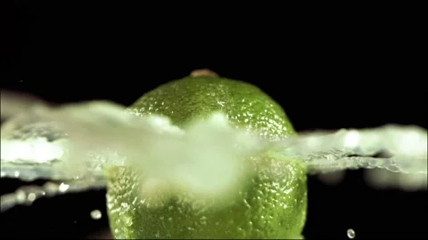 Half Lime falling and splashing on white... | Stock Video | Pond5