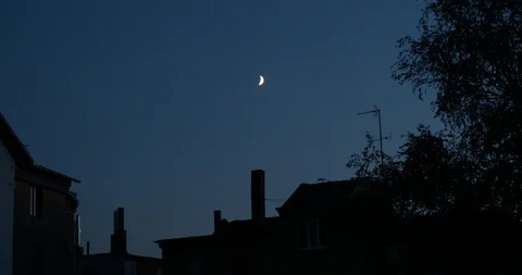 Half moon and Mars at evening over backs... | Stock Video | Pond5