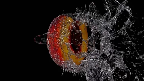 Half Peach Water Splash on Black Backgro... | Stock Video | Pond5