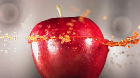 Half Red Apple falling and splashing on ... | Stock Video | Pond5