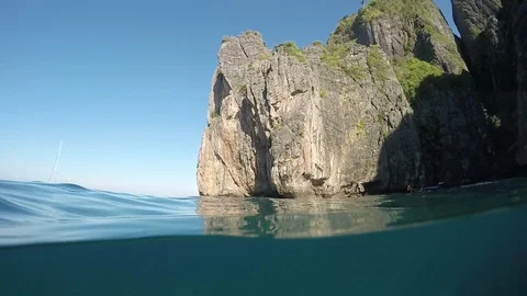 HALF UNDERWATER Calm ocean waves roll pa... | Stock Video | Pond5