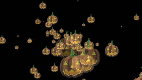 Halloween pumpkins fly in front on a bla... | Stock Video | Pond5