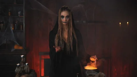 Halloween, witch use magic book and caul... | Stock Video | Pond5