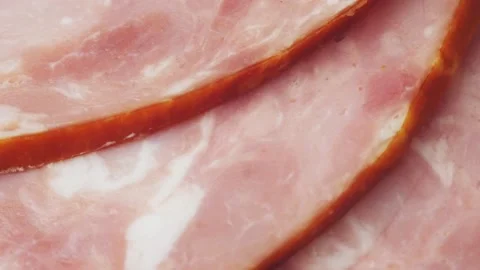 Ham cut into thin slices close-up. Slice... | Stock Video | Pond5