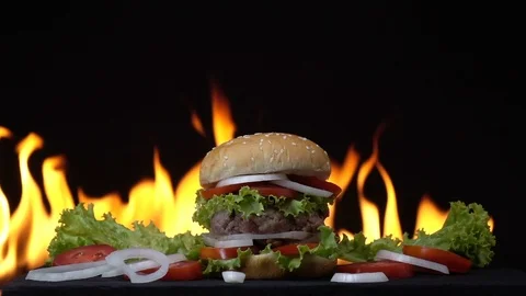 Hamburger fast food on fire slow motion ... | Stock Video | Pond5