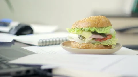 Hamburger in the office, fast food for l... | Stock Video | Pond5