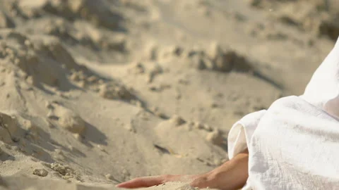 Hand of ancient monk in desert pouring s... | Stock Video | Pond5