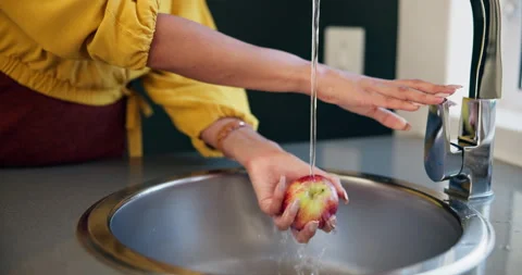 Hand, apple and washing in sink with wat... | Stock Video | Pond5