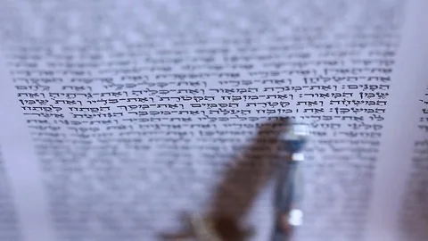 Hand of boy reading the Jewish Torah at ... | Stock Video | Pond5