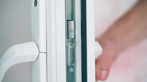 A hand checks the operation of the handl... | Stock Video | Pond5