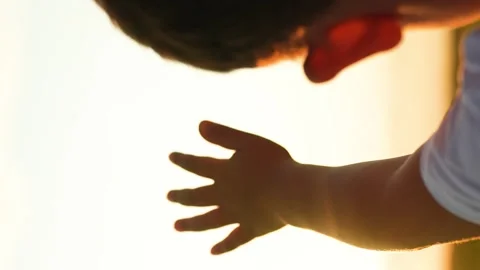 Hand of child boy stretches to beautiful... | Stock Video | Pond5