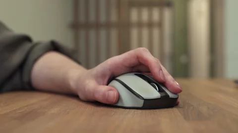 Hand on computer mouse, finger scrolling... | Stock Video | Pond5