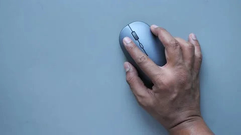 hand with computer mouse on gray color b... | Stock Video | Pond5