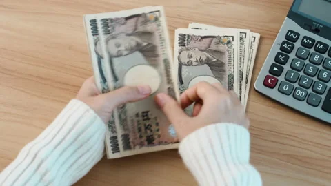 hand counting Japanese Yen banknote. Tho... | Stock Video | Pond5