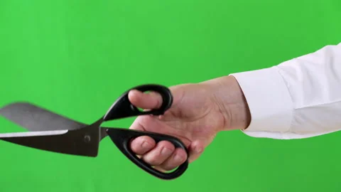 Hand cutting with scissors. Snipping. Gr... | Stock Video | Pond5