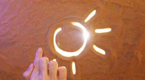 Hand drawing Sun symbol in the sand. Bea... | Stock Video | Pond5