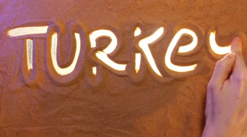 Hand drawing Turkey symbol in the sand. ... | Stock Video | Pond5