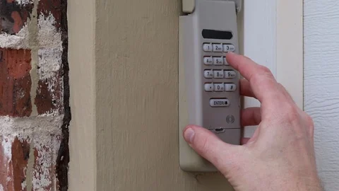 Hand entering code on Keypad used on a g... | Stock Video | Pond5