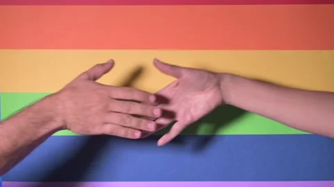 Hand fist with lgbt flag background. Lgb... | Stock Video | Pond5