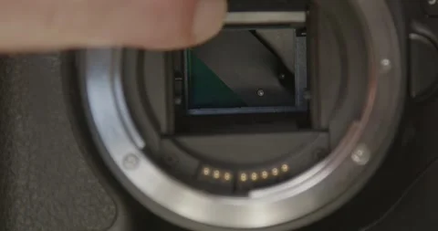 Hand flipping up mirror of DSLR camera a... | Stock Video | Pond5