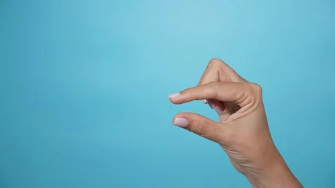 Hand forming gesture as if showing big a... | Stock Video | Pond5