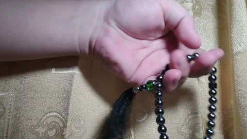 hand gesture moving prayer beads with cu... | Stock Video | Pond5