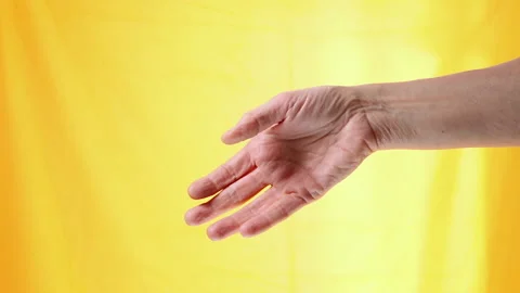 Hand gestures on yellow background | Stock Video | Pond5