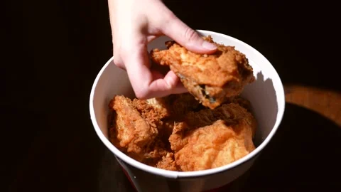 hand grabs fried chicken from to go cont... | Stock Video | Pond5