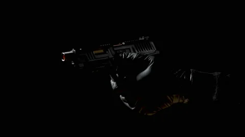 Hand gun side profile shooter holding gu... | Stock Video | Pond5