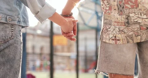 Hand to hand. Cropped view of the couple... | Stock Video | Pond5