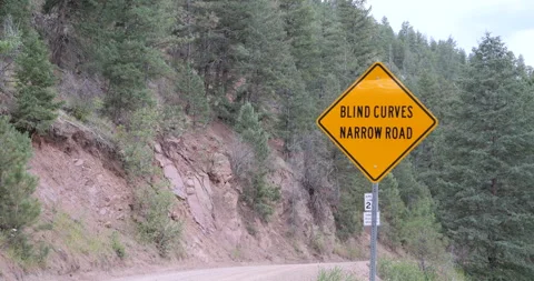 Hand held shot of blind curve narrow roa... | Stock Video | Pond5