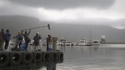 hand held wide shot of a film crew with ... | Stock Video | Pond5