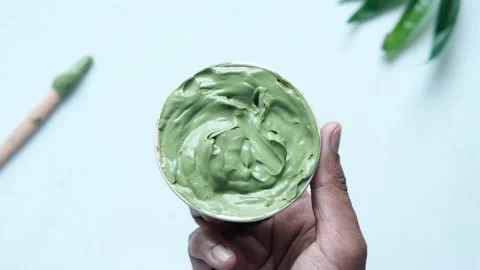 hand hold a container of a clay mask top... | Stock Video | Pond5