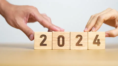 hand holding 2024 year block on table. g... | Stock Video | Pond5